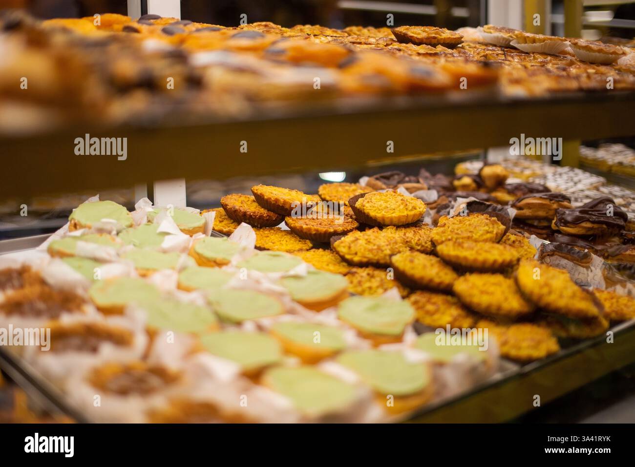Fresh baked cookies in different shapes and flavors in bakery ...
