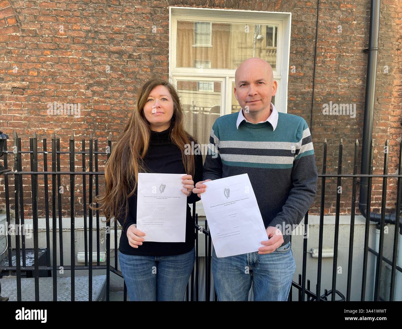People Before Profit councillor Jess Spear and People Before Profit TD Paul Murphy pose for a ...
