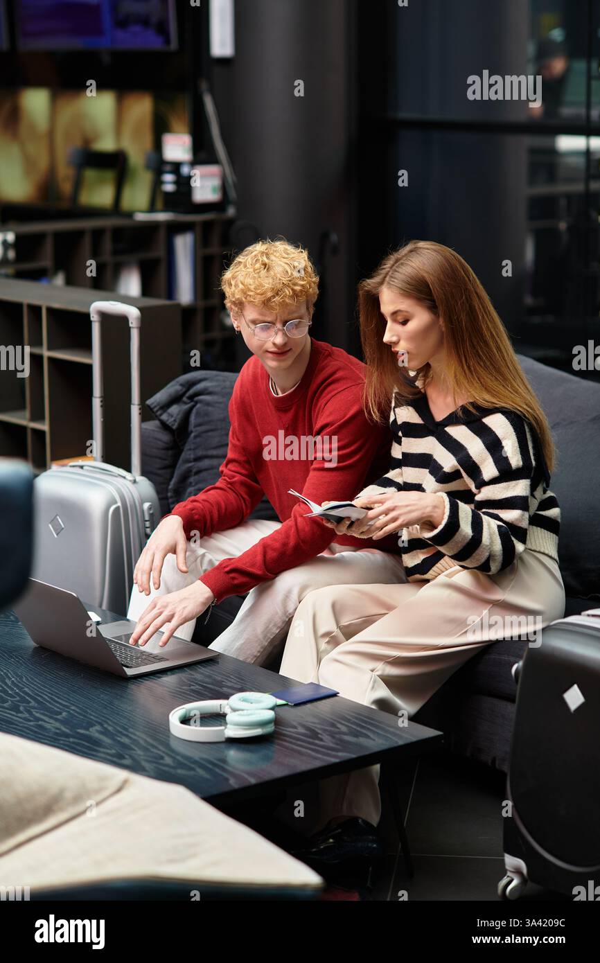 Loving couple engages in planning their adventures while relaxing in a ...