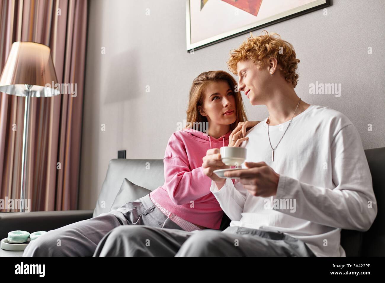 Loving couple enjoys intimate conversation and warmth while sipping ...