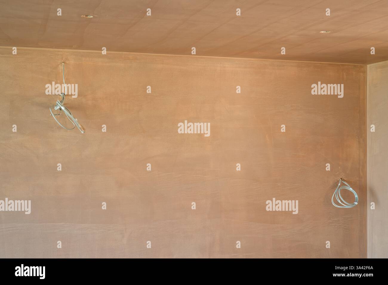 A newly plastered room with electrical switching, first fit wiring ...