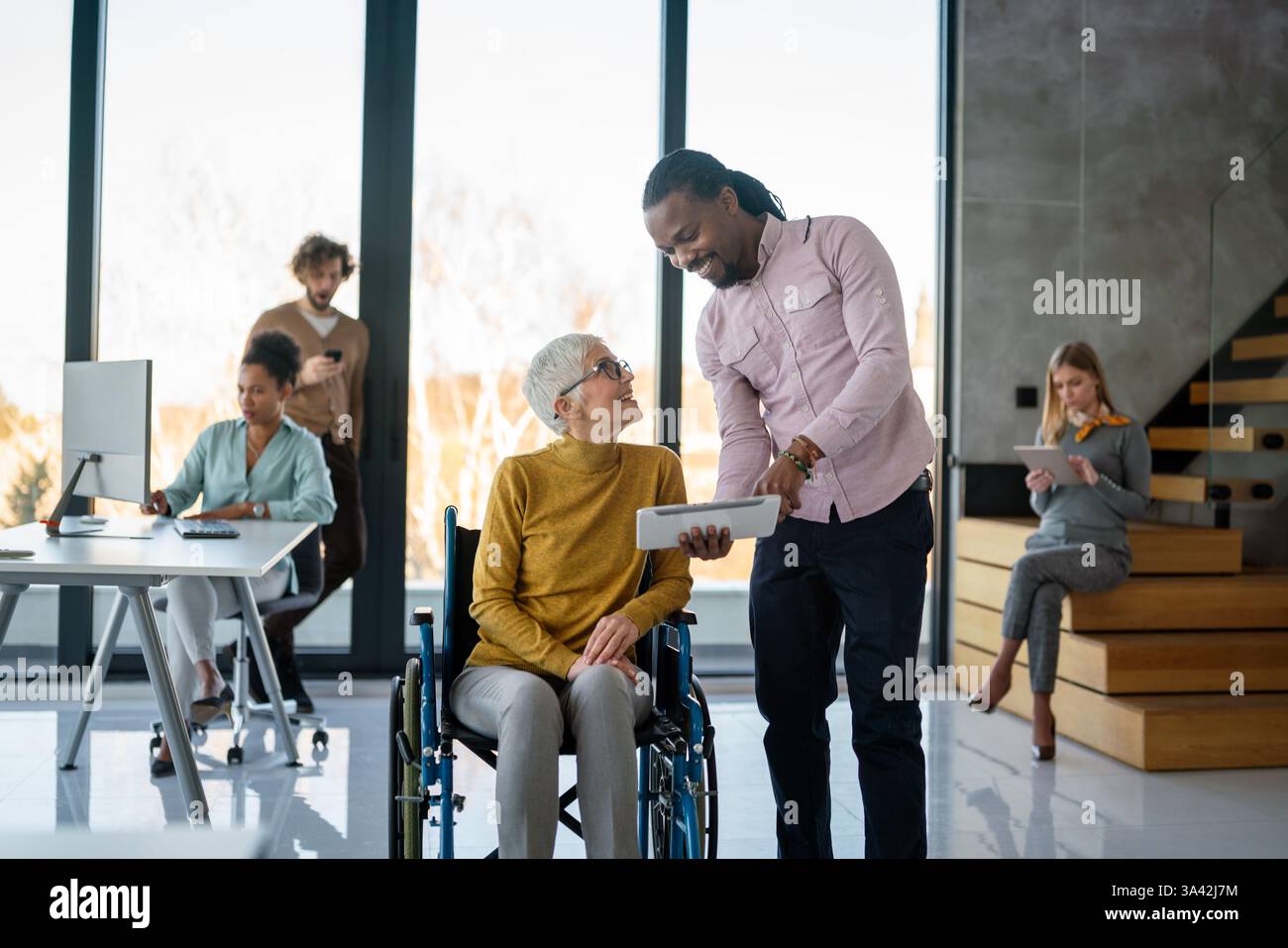 The image includes a person using a wheelchair, depicting inclusivity ...