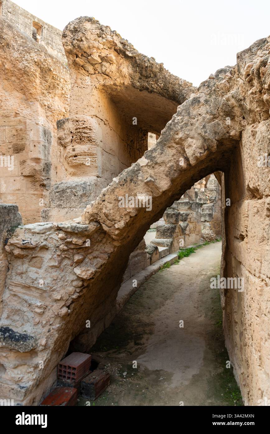 Stone buttress over a narrow path inside the Roman ampitheatre in el ...