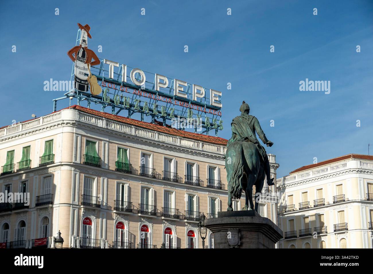 A statue of a man on a horse is outside a building labeled Tio Pepe ...
