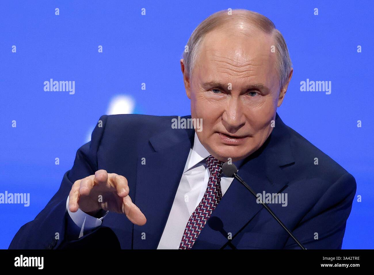 Russian President Vladimir Putin gestures while speaking at the annual ...