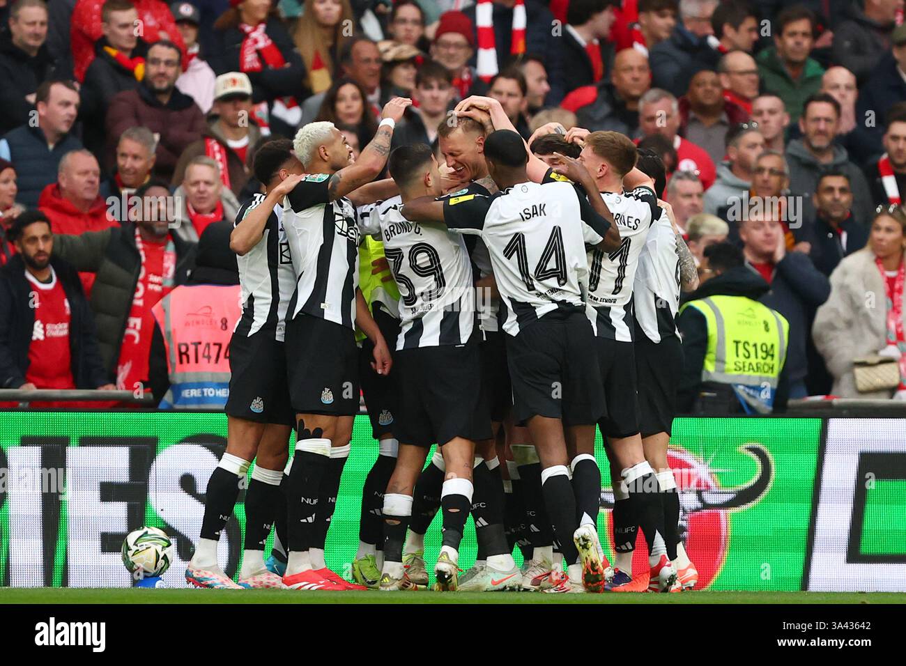 Dan Burn of Newcastle United is congratulated after scoring a goal to ...