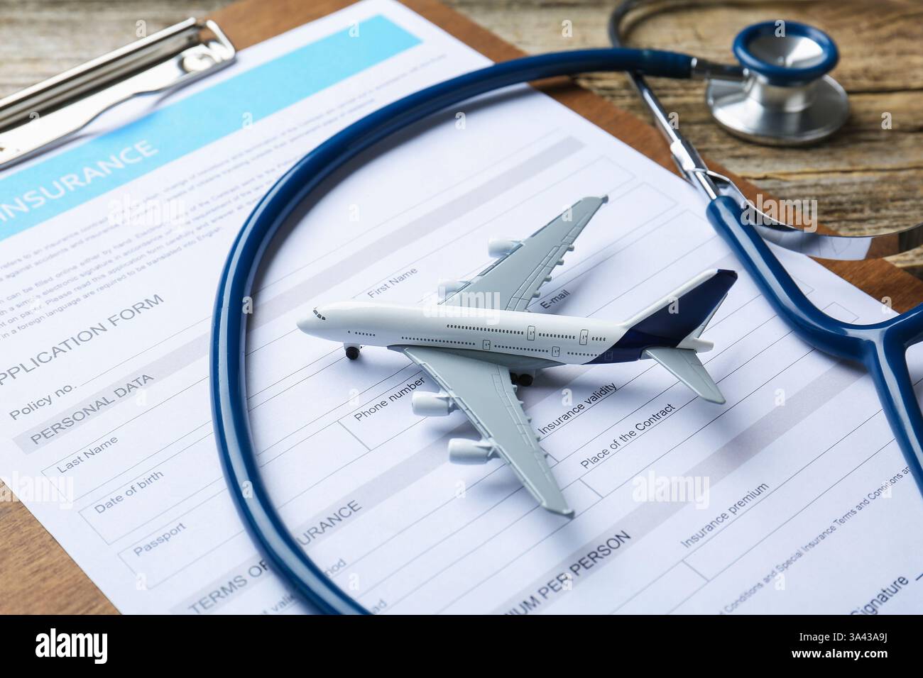 Medical tourism. Travel insurance application form, stethoscope and ...