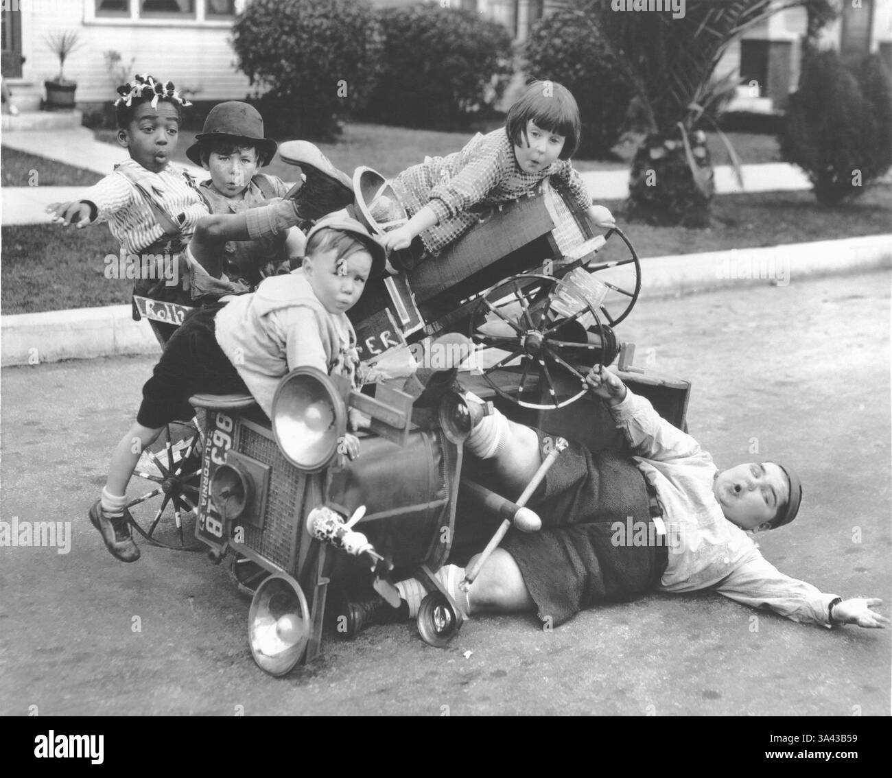 Our Gang cast in a crashing scene in the street Stock Photo - Alamy