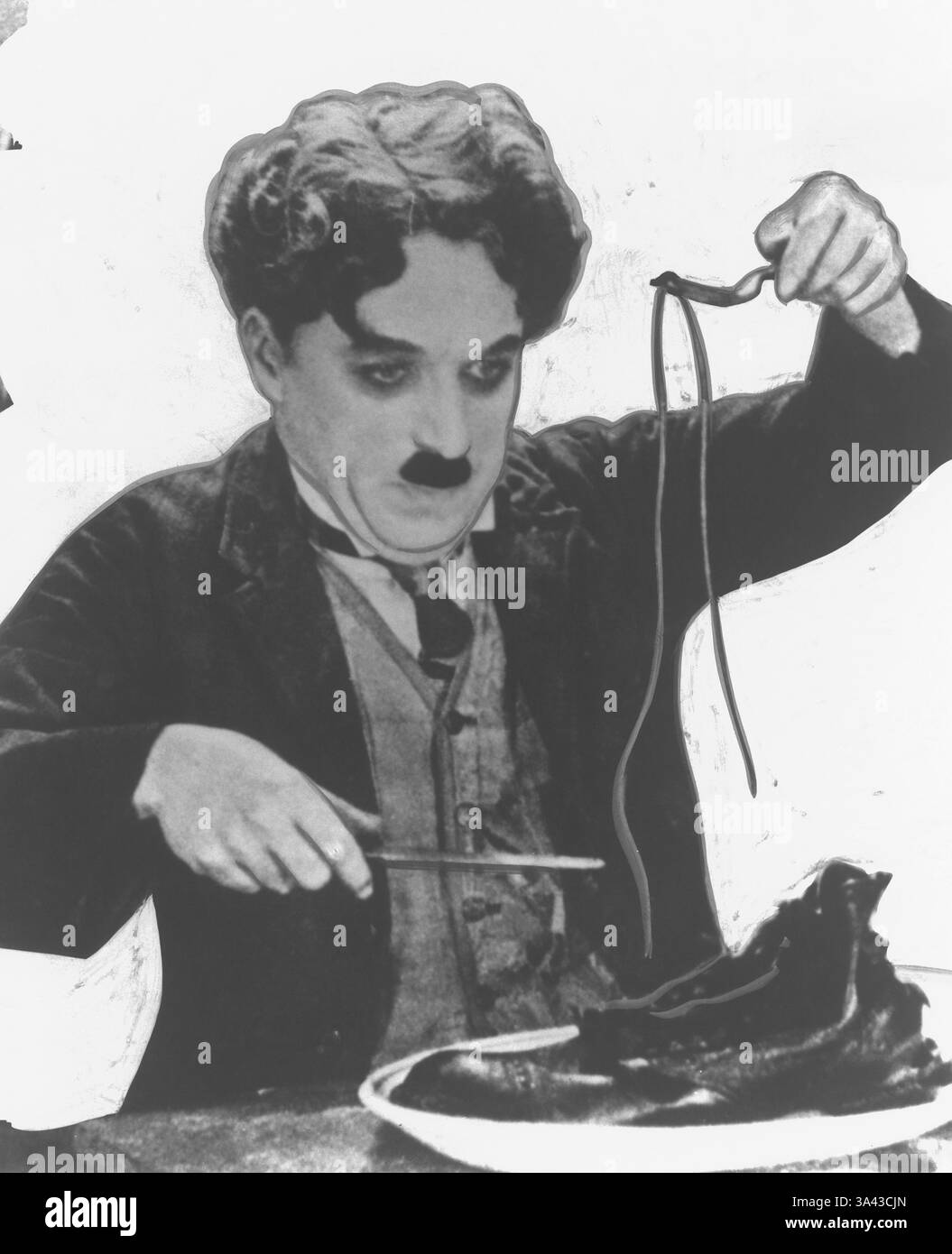 Charlie Chaplin eating his shoe in The Gold Rush Stock Photo - Alamy