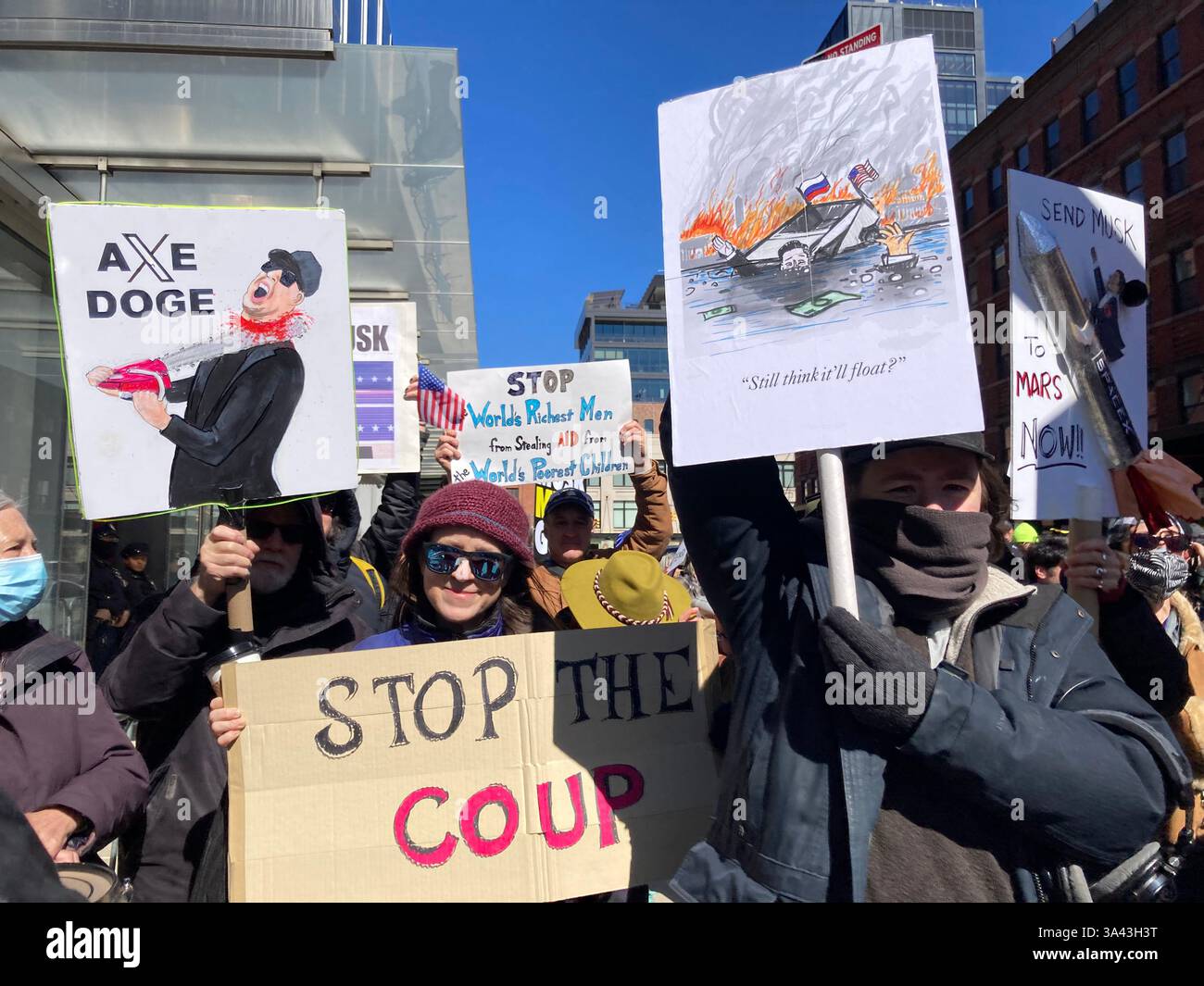 Protesters participate in a “Tesla Takedown”outside of the Tesla ...