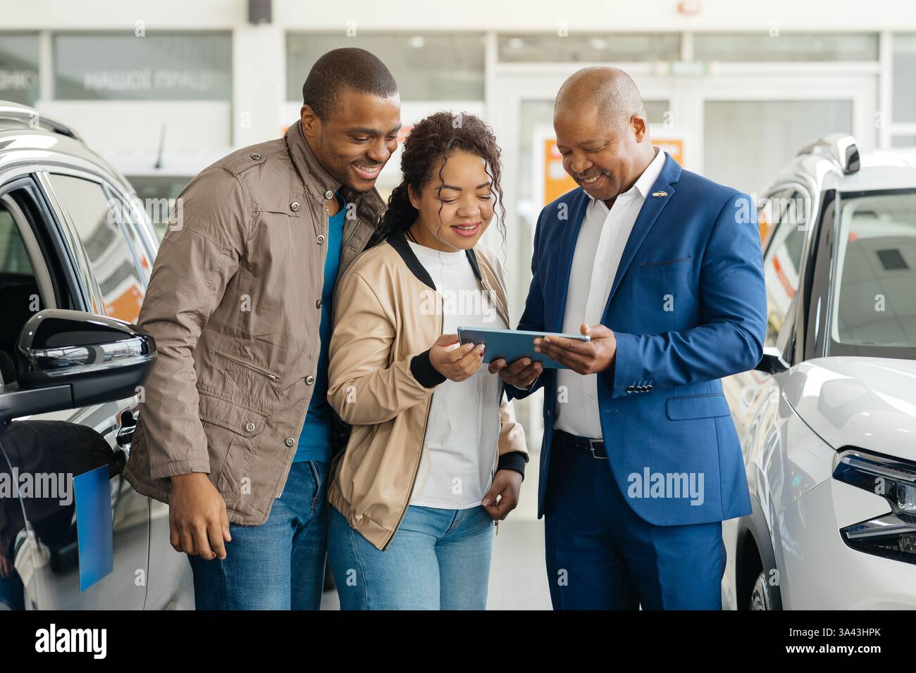 Exciting African American couple explores car options with dealership ...
