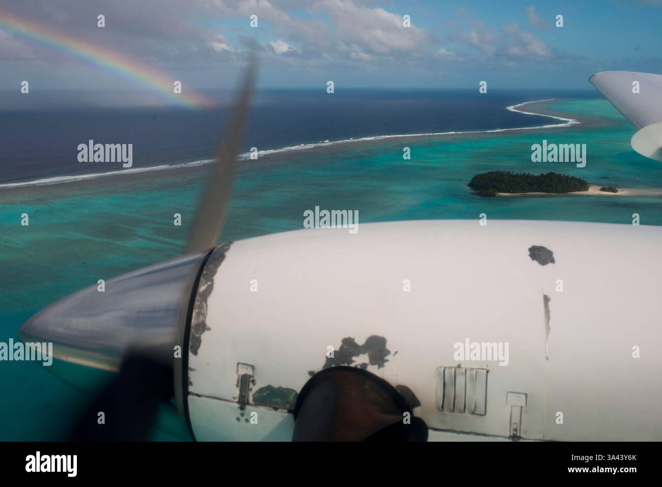 Aitutaki. Cook Island. Polynesia. South Pacific Ocean. A plane flies ...