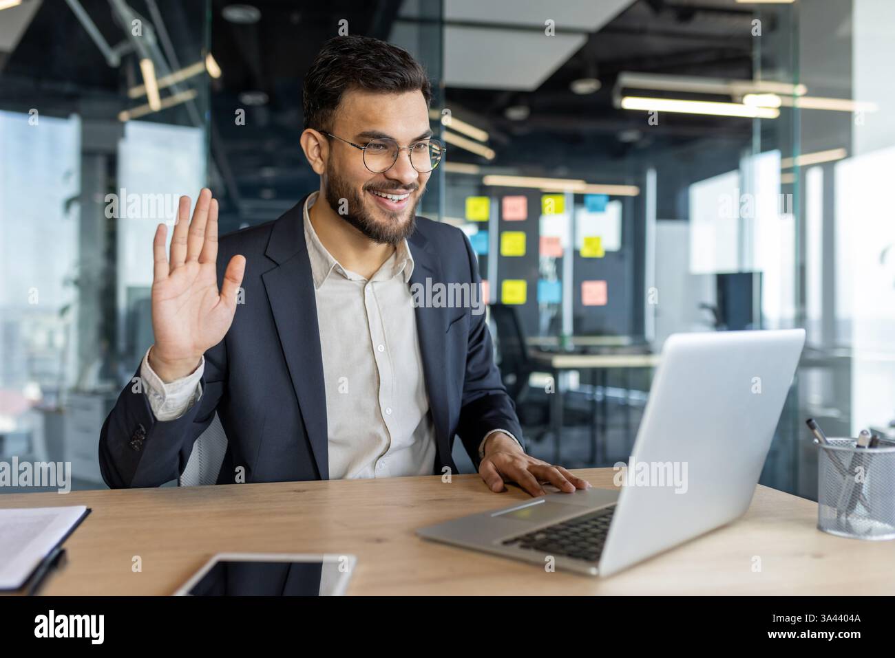 Asian people happily waving greeting hi-res stock photography and ...