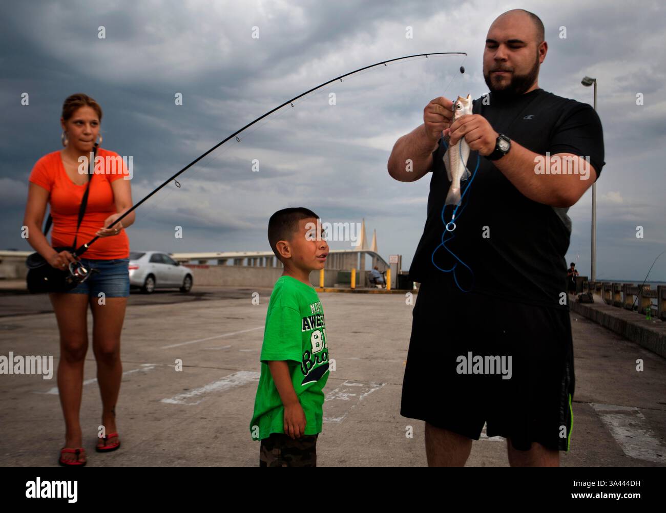 May 27, 2014 - Florida, U.S. - Steven Colon Jr, 3, (center) watches his ...