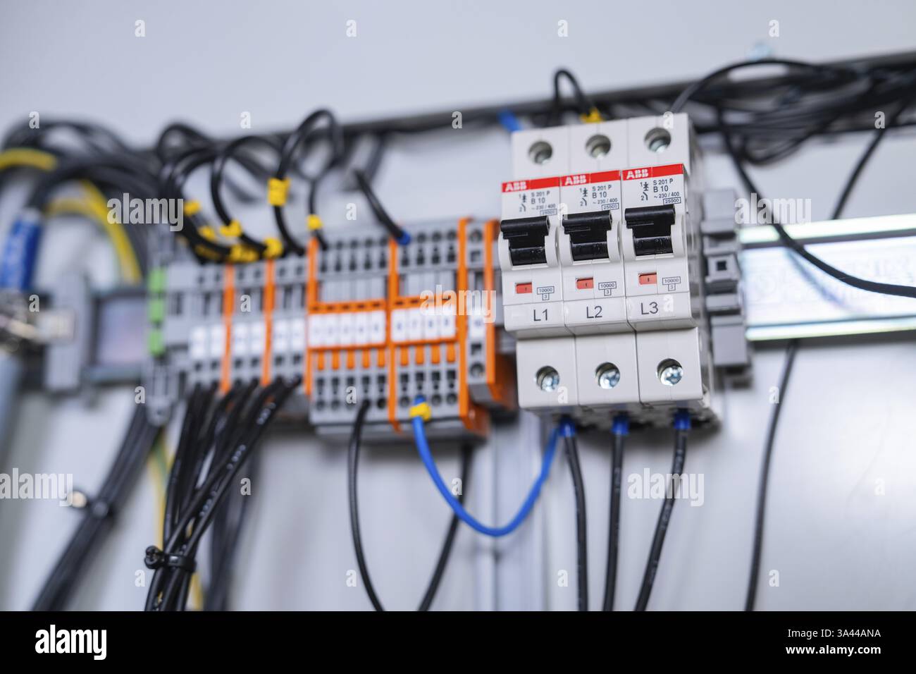 Close-up of circuit-breakers and cables in an electrical system ...