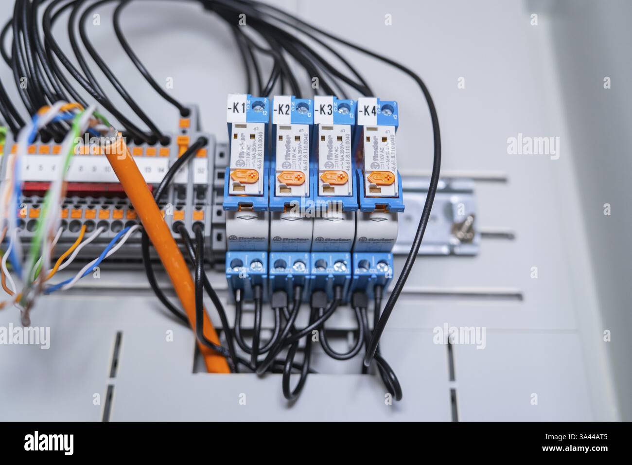 Functional arrangement of blue relays, wired in an electrical system ...
