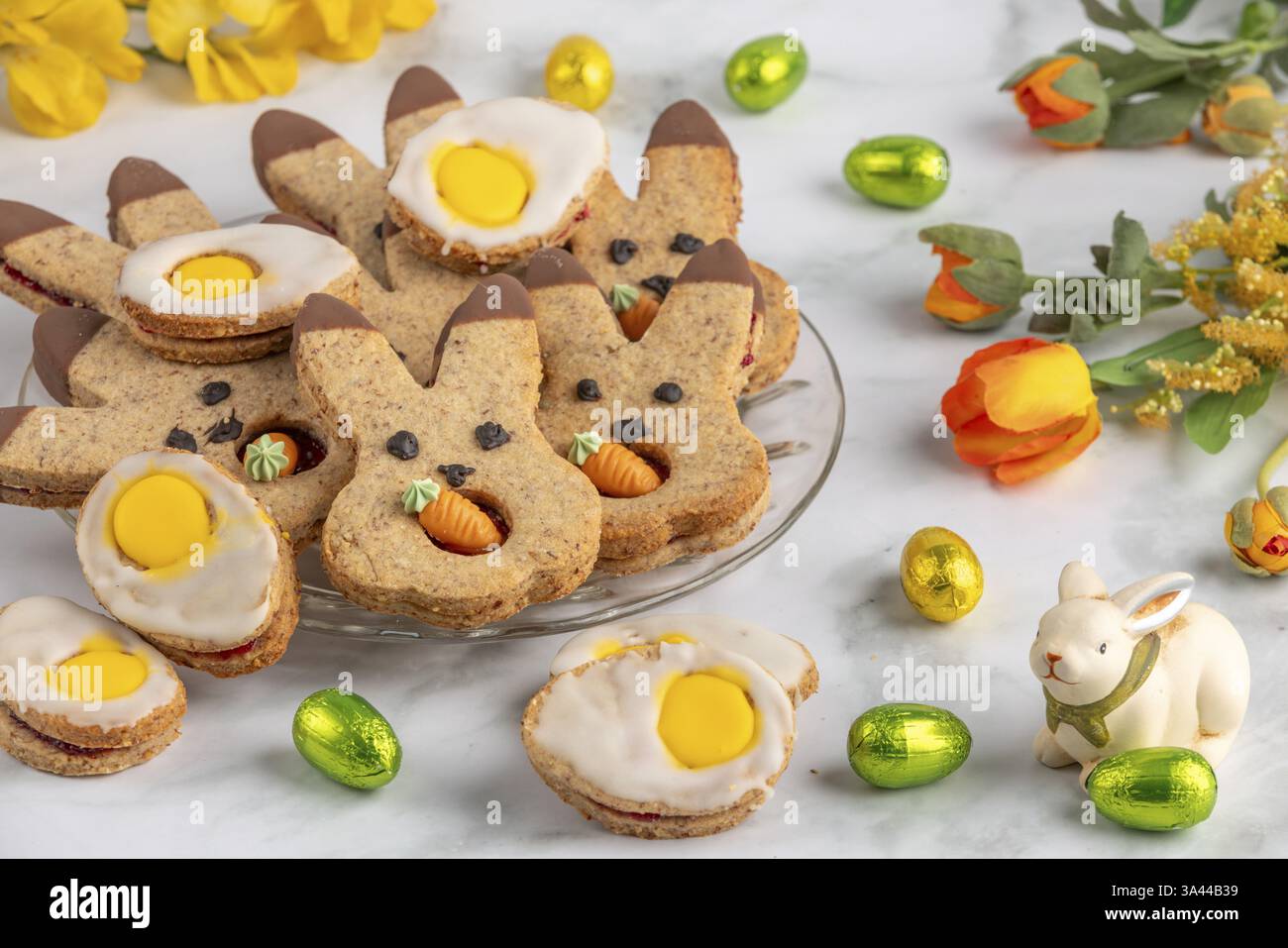 Bunny biscuits and egg biscuits decorated with icing next to Easter ...