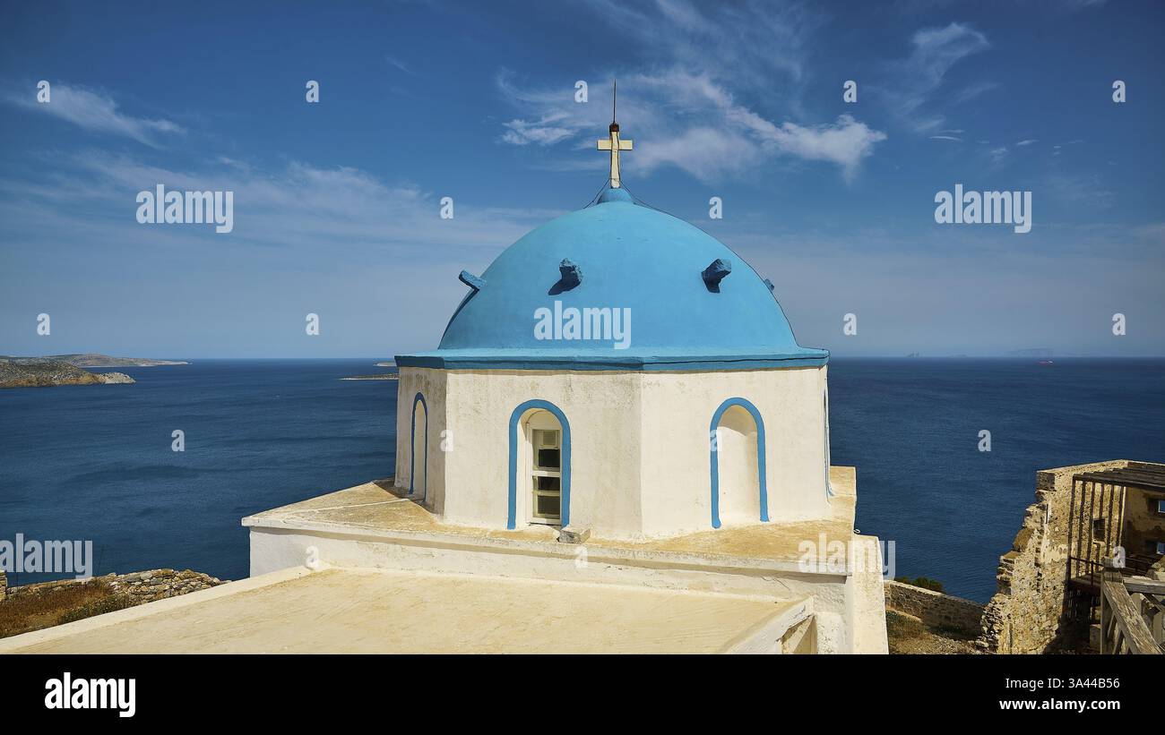 Blue church tower with sea view and clear sky, traditional Greek design ...