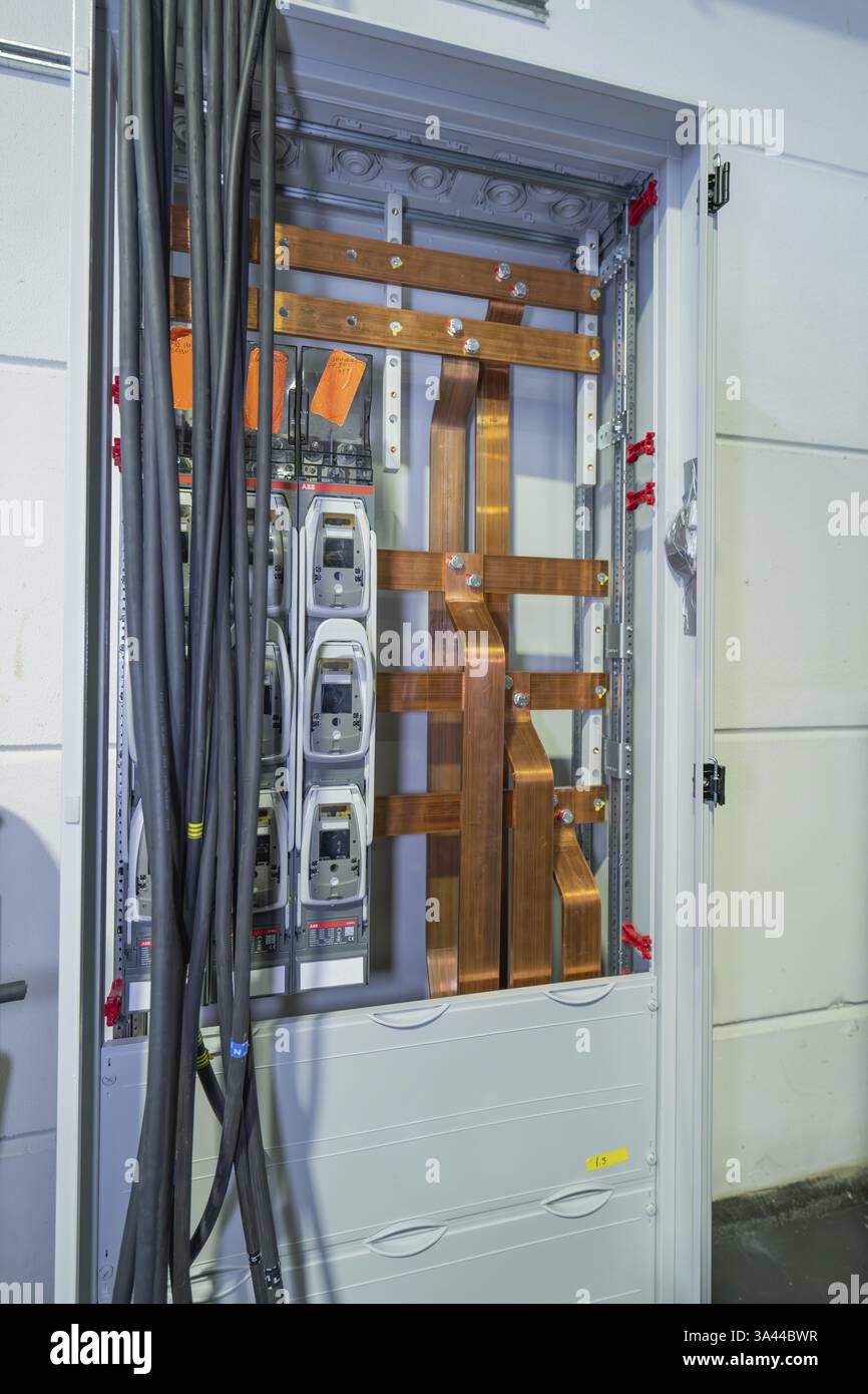Open cable cabinet with visible copper rods and power cables, switch ...
