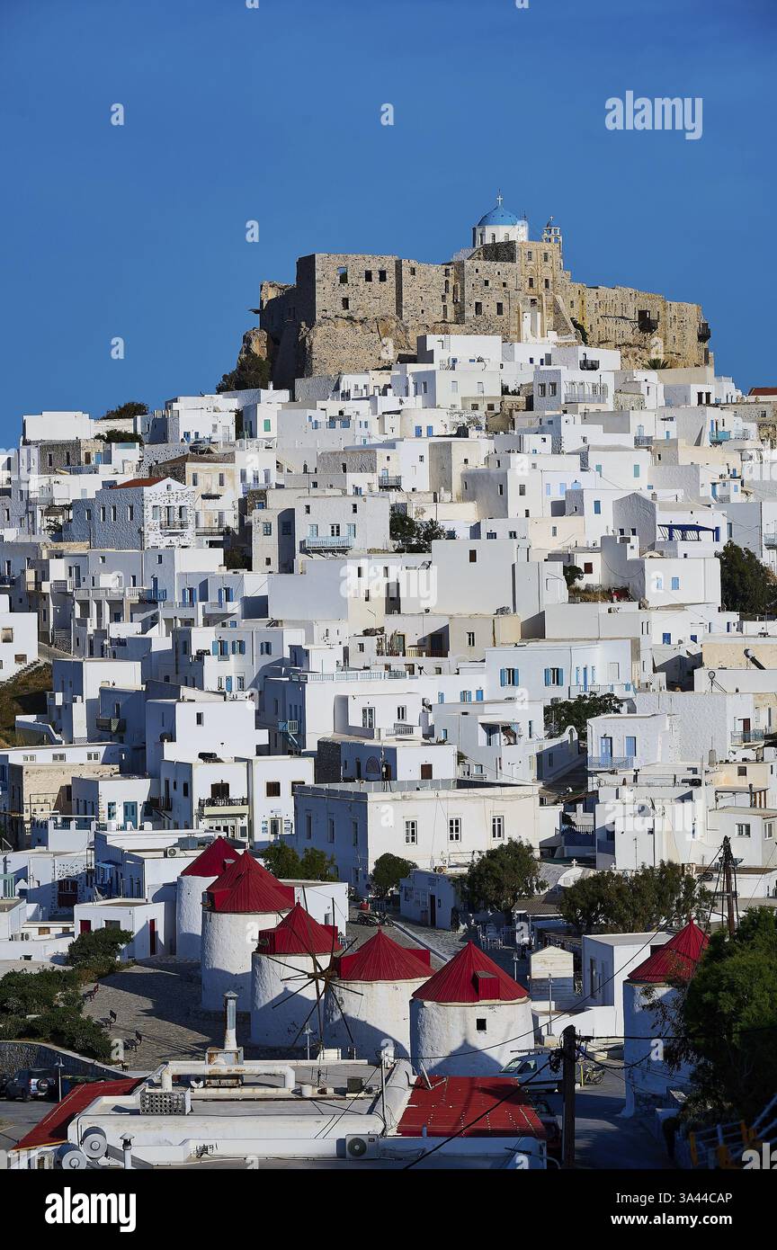 White hill town with red windmill roofs under a bright sky, Querini ...