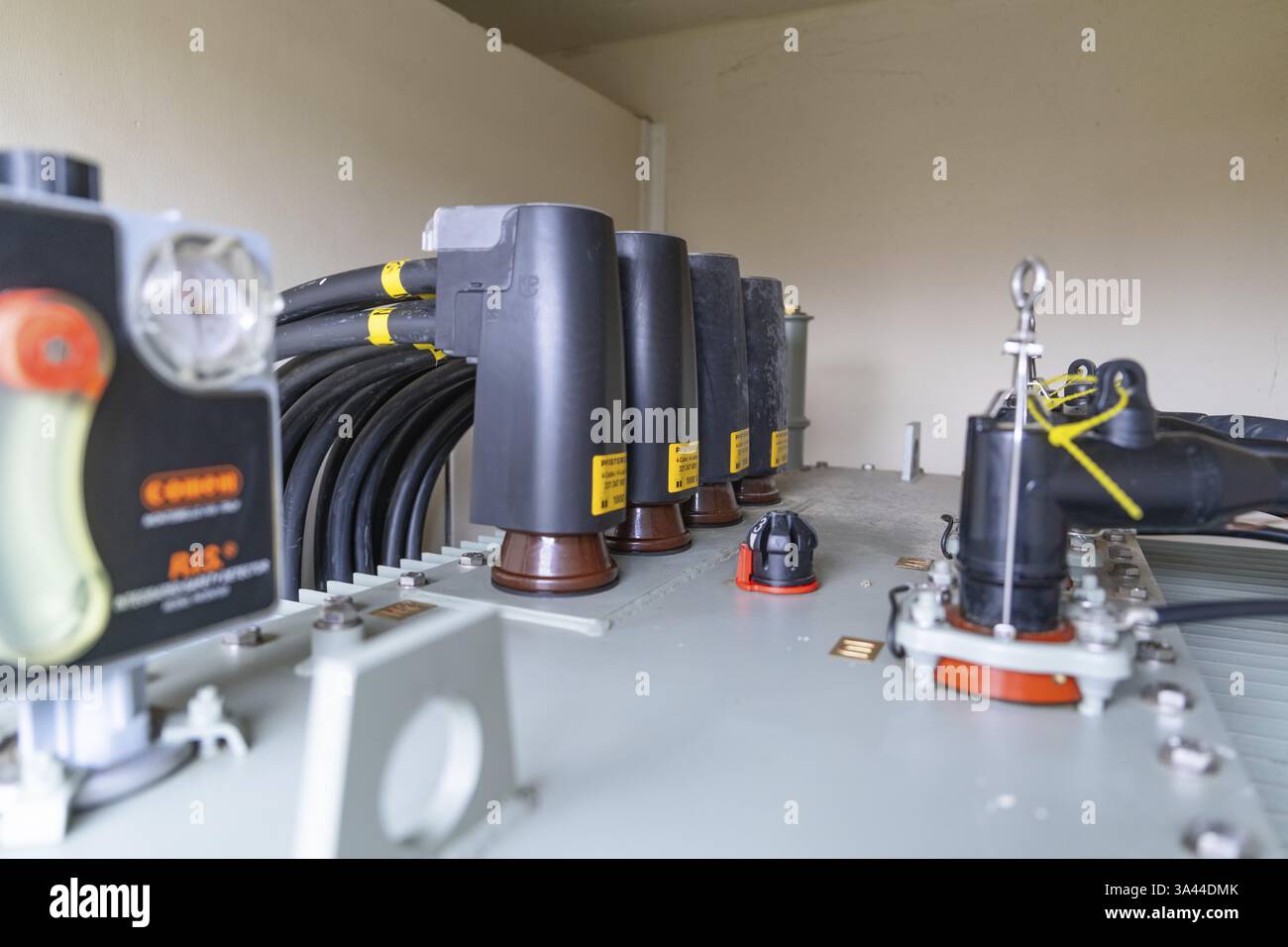 Detailed view of a transformer with several cable connections, switch ...