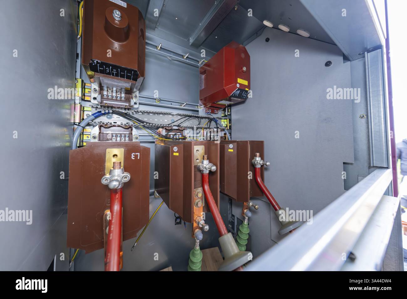 View into an open switch box with visible electrical components and ...