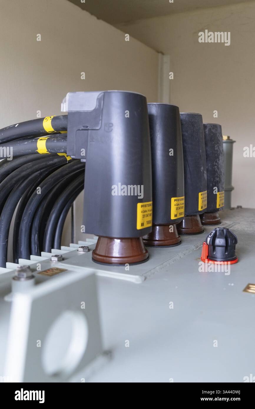 Electrical installation with several cables and connection devices ...