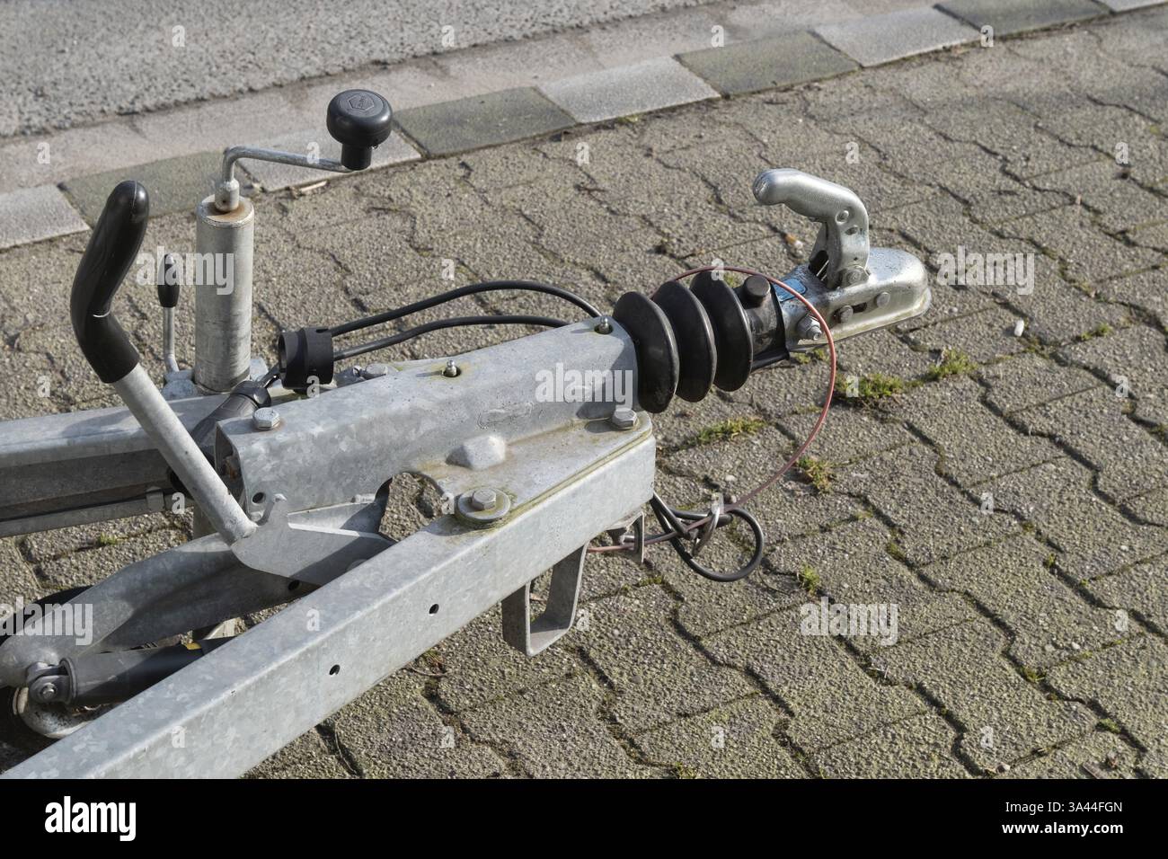 Close-up of trailer coupling mechanism featuring a crank handle ...