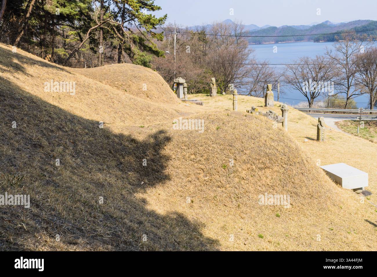 Daejeon, South Korea, March 29, 2019: Burial mounds with ornate markers ...