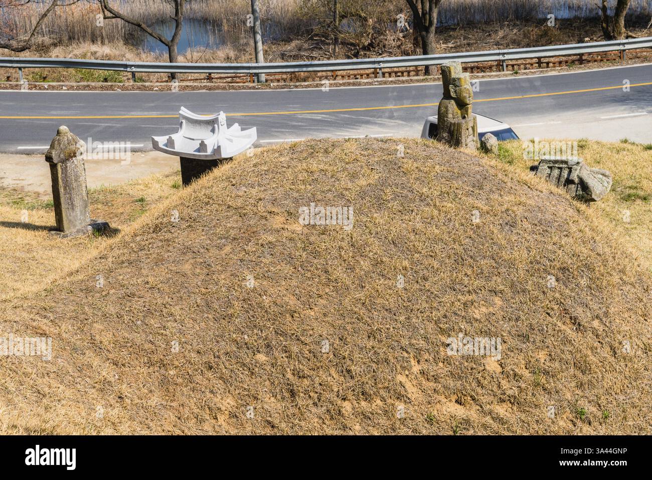Daejeon, South Korea, March 29, 2019: Burial mound with ornate markers ...