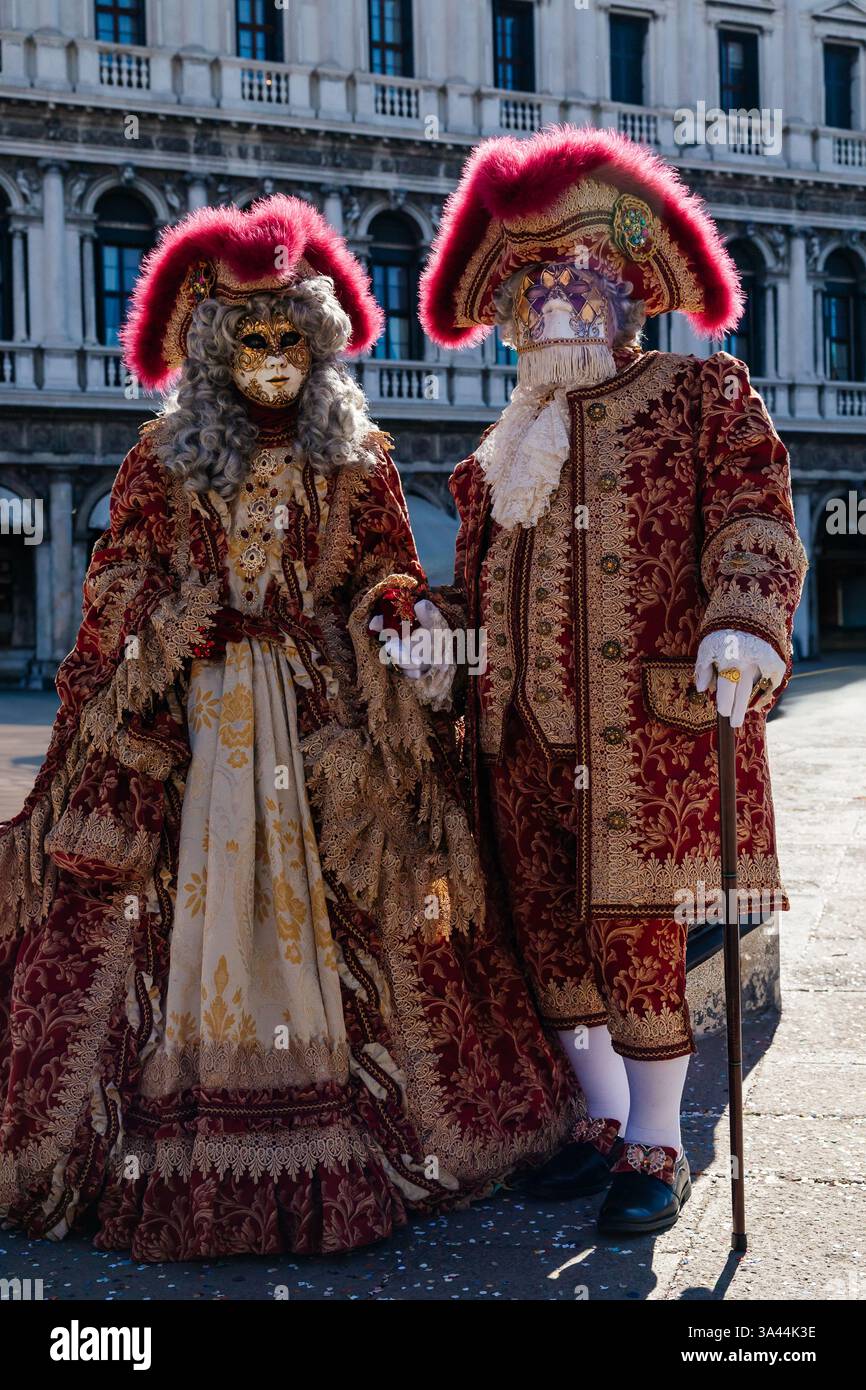 Venetian Carnival Duo: Traditional Masks and Attire Stock Photo - Alamy