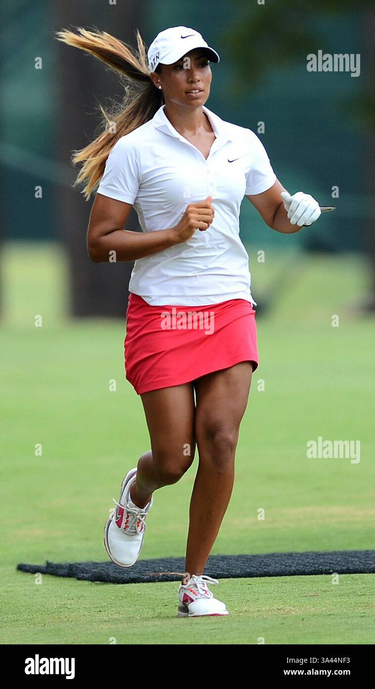 June 18, 2014 - Pinehurst, NC, USA - Cheyenne Woods jogs from the 13th tee box to catch up with ...
