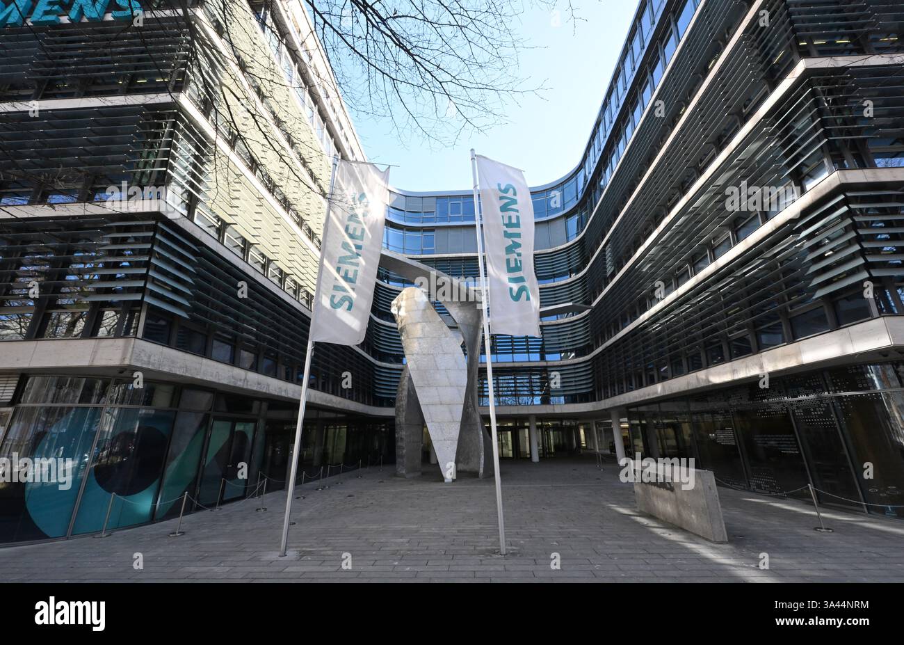 Munich, Germany. 18th Mar, 2025. Flags with the inscription "Siemens" fly at the Siemens ...