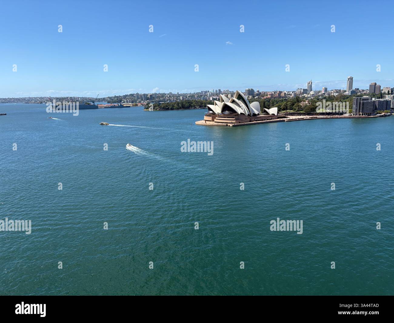 View of Sydney Opera House, water and boats from Sydney harbour bridge ...