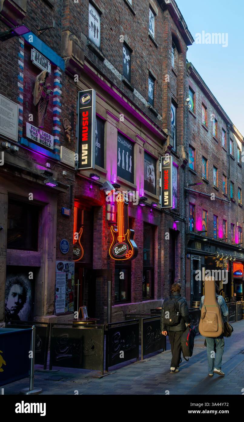 Men walking past with guitars, Eric's music club, Mathew Street ...