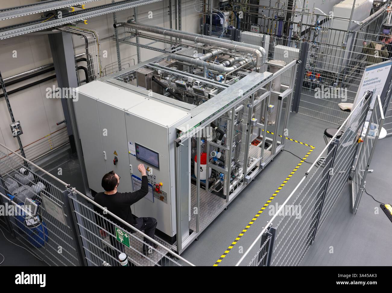 Leipzig, Germany. 18th Mar, 2025. An employee monitors the methanation ...