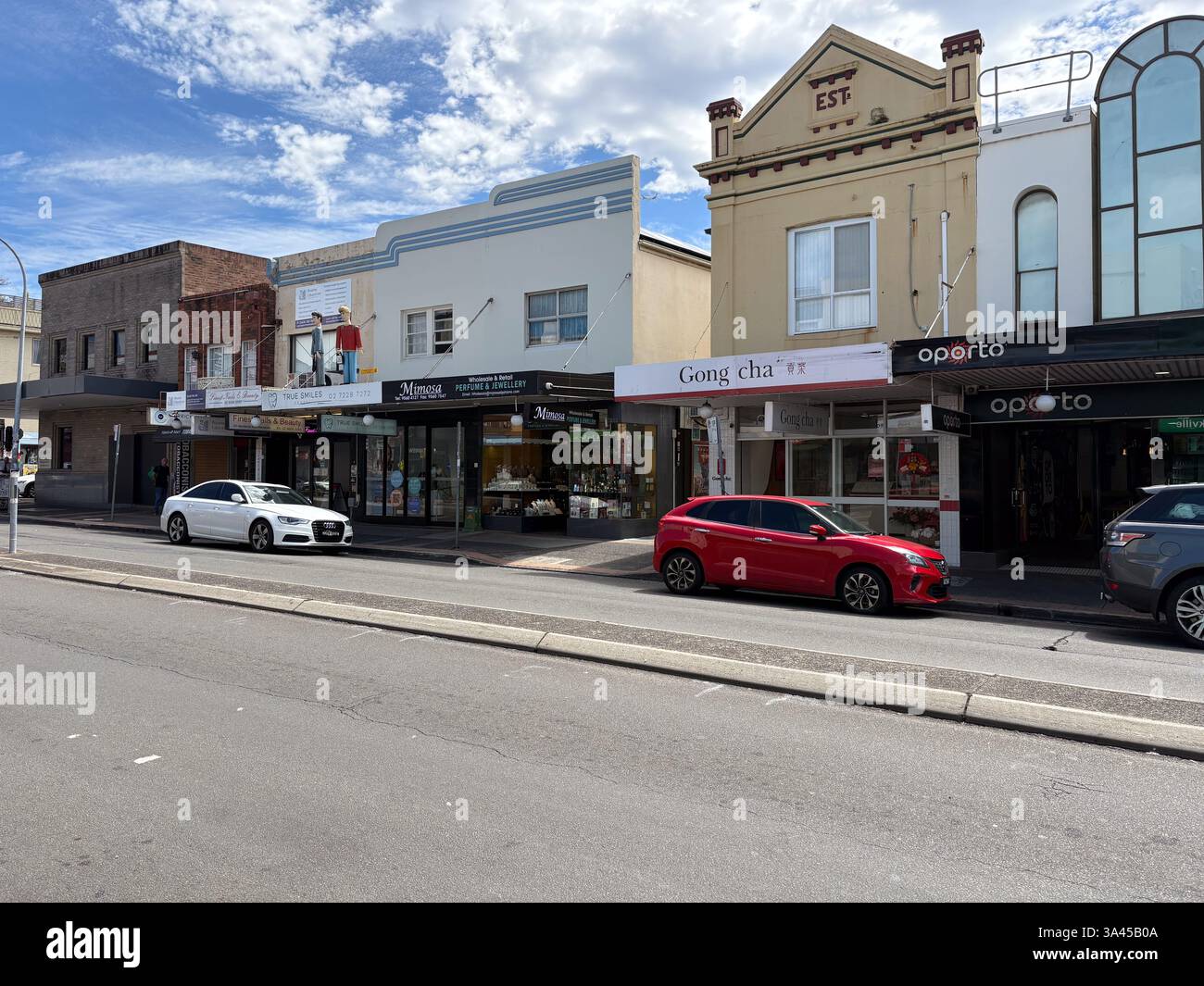 Picture of different commercial shops along a busy road. Oporto and ...