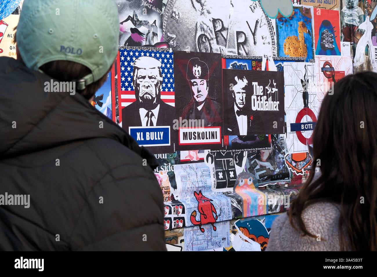 Brick Lane, London, UK. 18th Mar 2025. Posters critical of President ...
