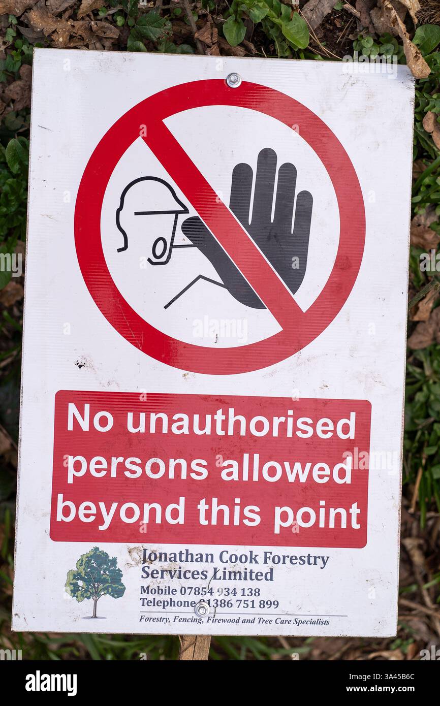 No unauthorised persons allowed beyond this point sign in a woodland ...