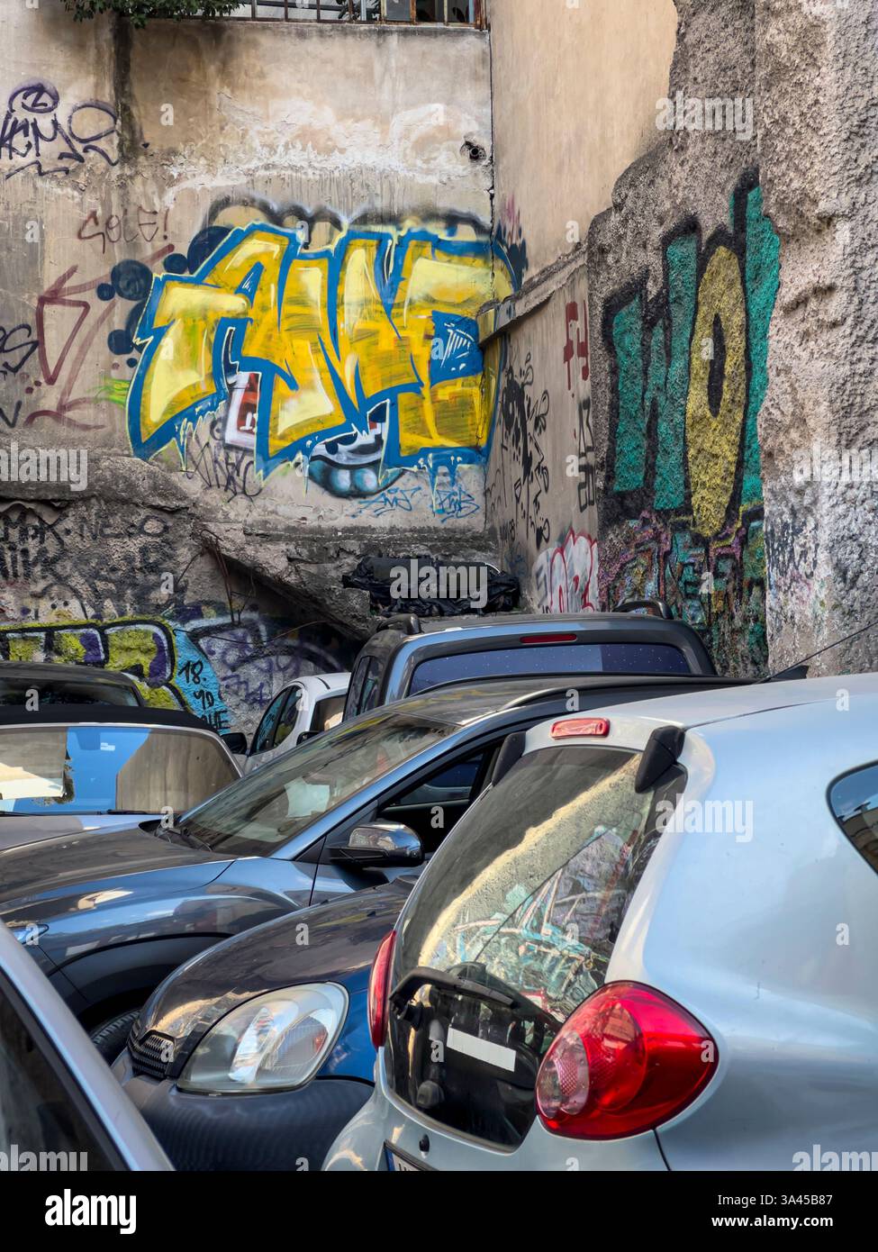 A vibrant graffiti mural adorns the wall of an old building, now ...