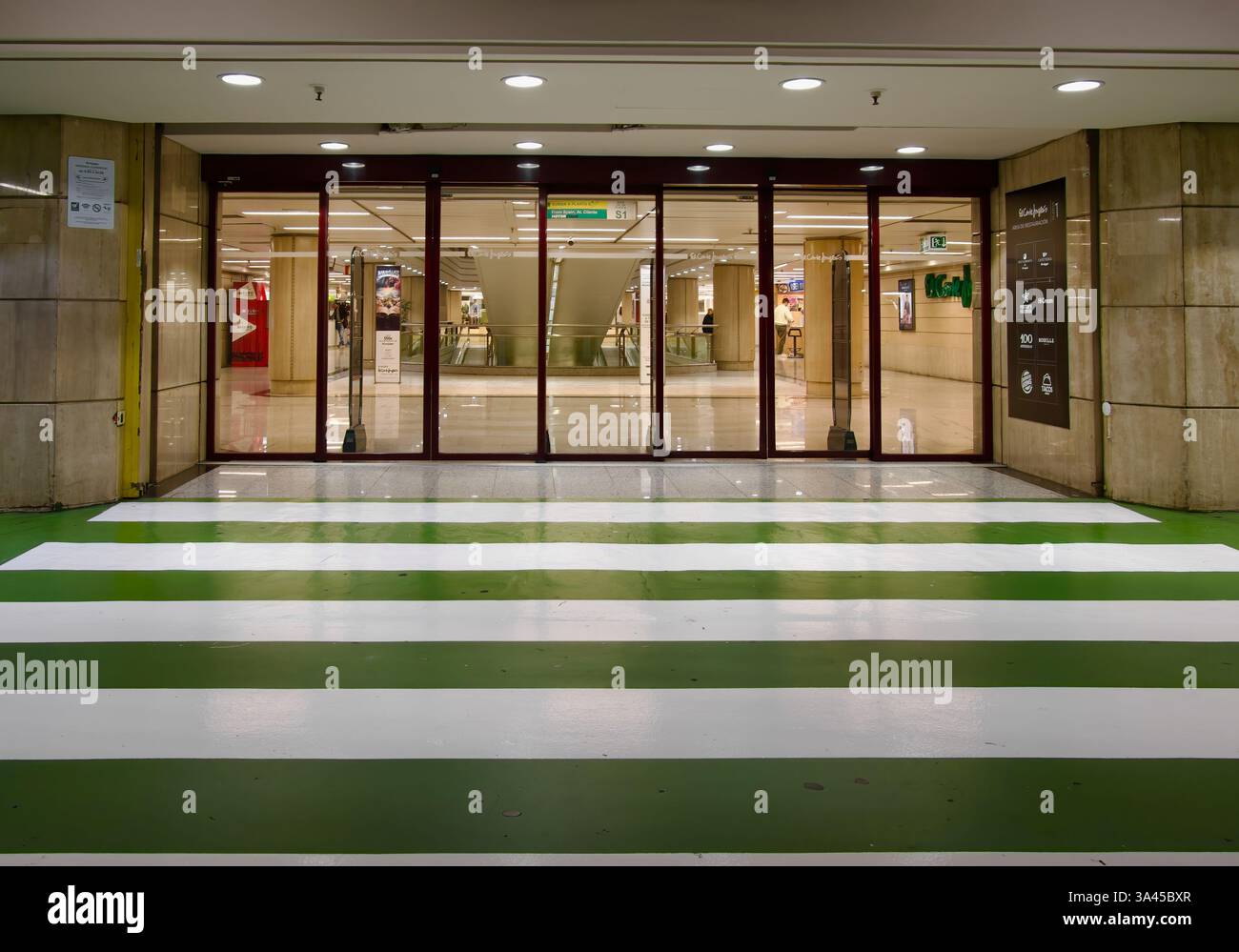 Sliding automatic double doors with a pedestrian crossing to the ...