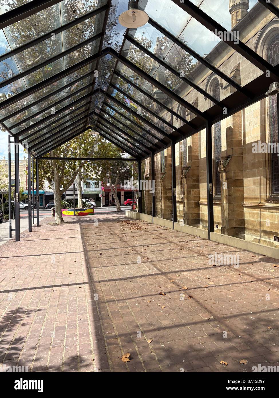 Glass walkway along wall in Paddington, Sydney featuring brick ground ...