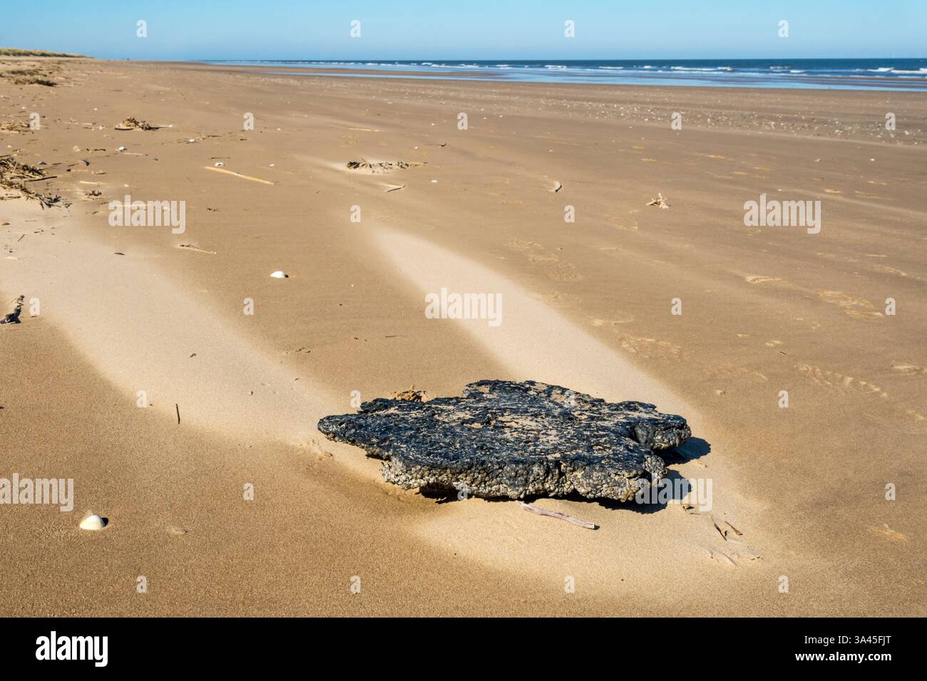 18 March 2025. Plastic pollution in the form of burnt & fused nurdles ...