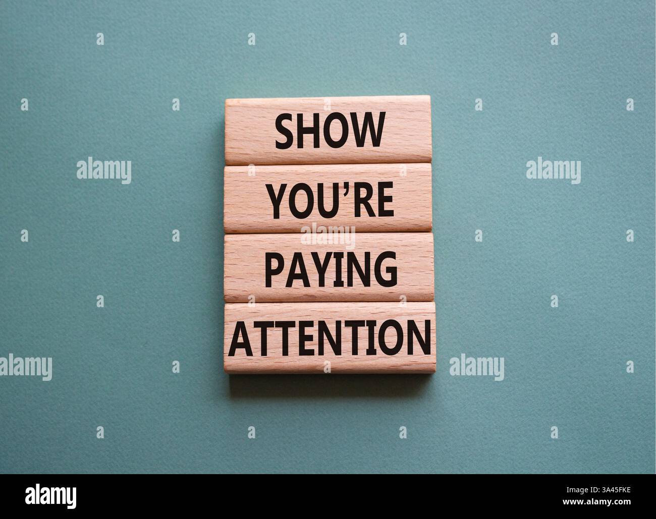 Attention symbol. Concept word Show You are Paying Attention on wooden blocks. Beautiful grey ...