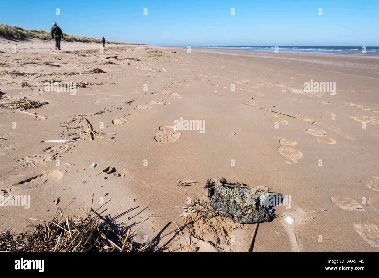 18 March 2025. Plastic pollution in the form of burnt & fused nurdles ...