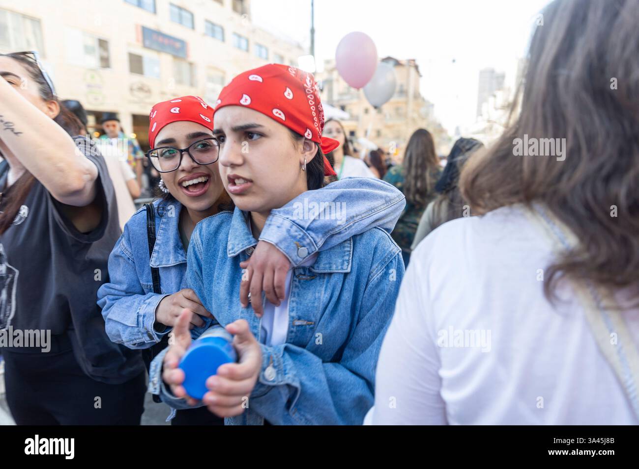Jerusalem, Israel, March 16, 2025, Purim in the city. Two girls in red ...
