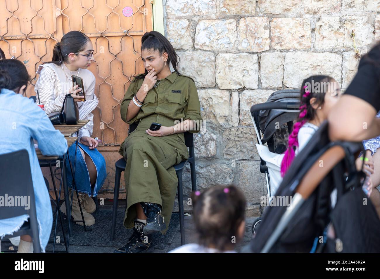 Jerusalem, Israel, March 16, 2025, A thoughtful girl in IDF military ...