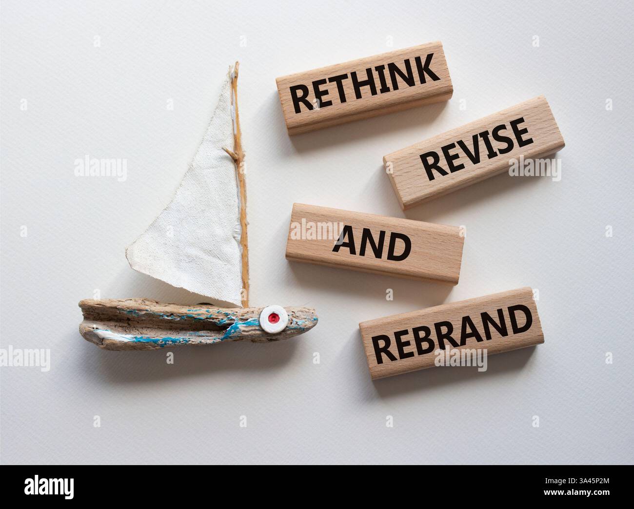 Rethink Revise and Rebrand symbol. Wooden blocks with words Rethink ...