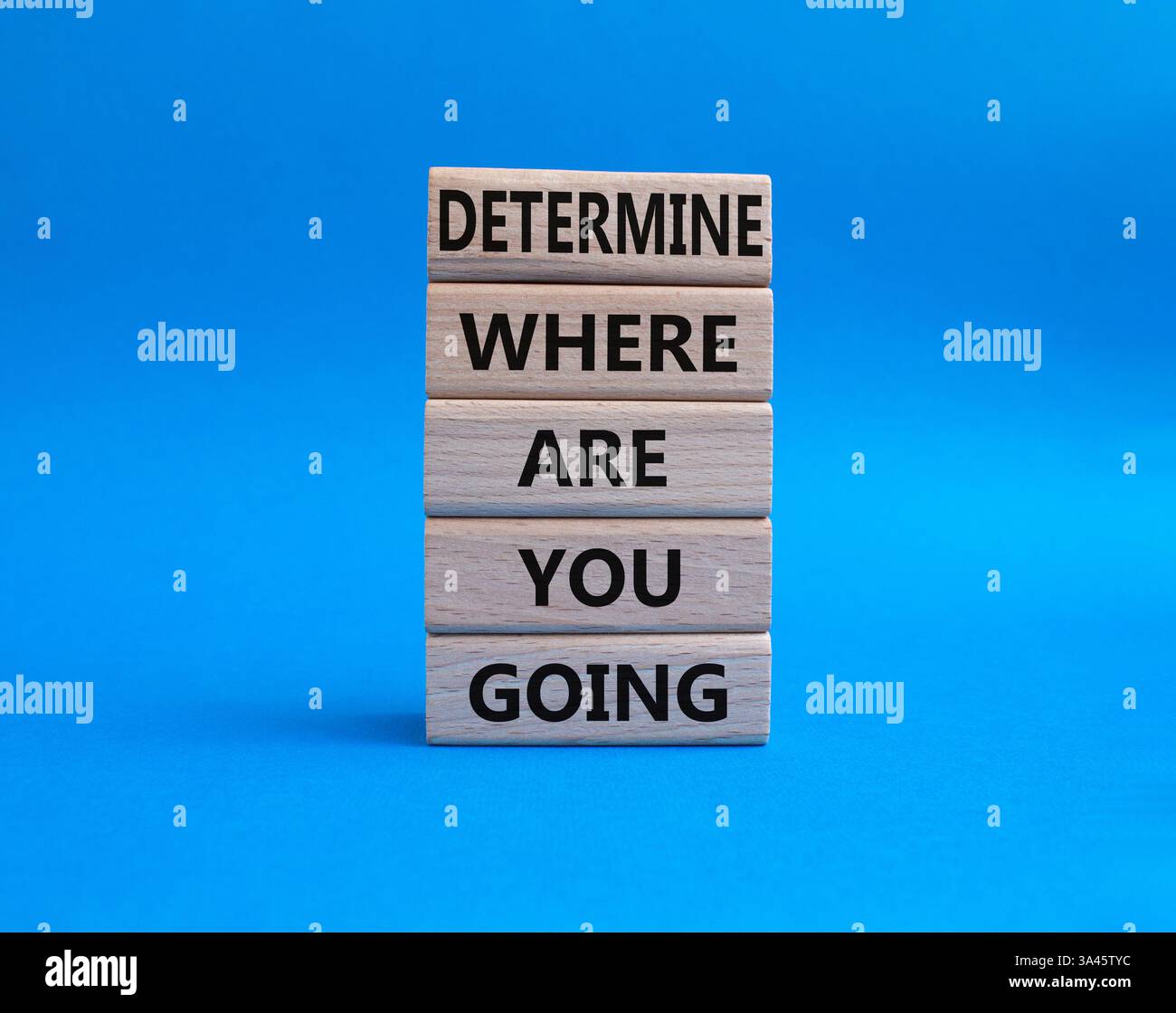 Determination symbol. Wooden blocks with words Determine where you are ...