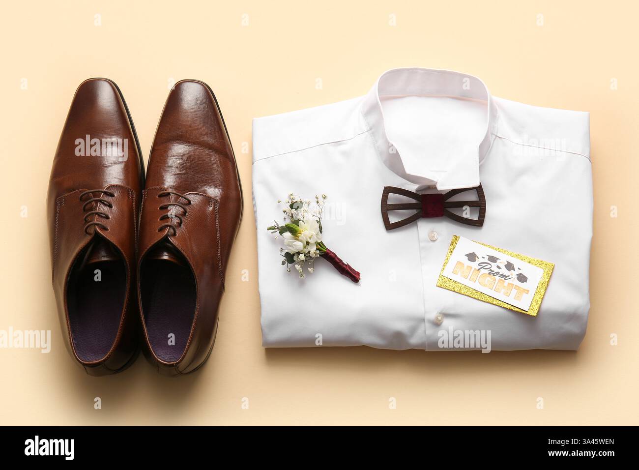 Paper sheet with text PROM NIGHT, shoes, shirt and boutonniere on beige ...